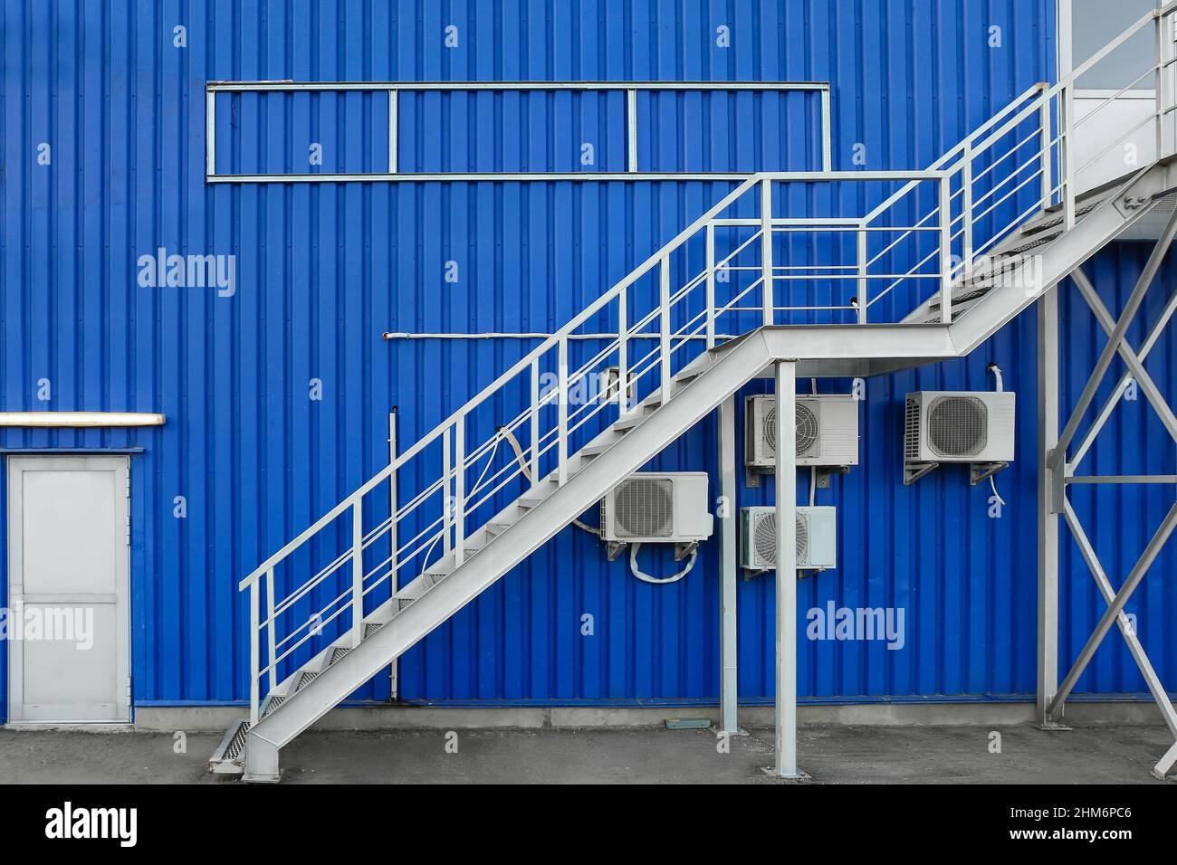 Modern metal stairs of blue building outdoors Stock Photo - Alamy