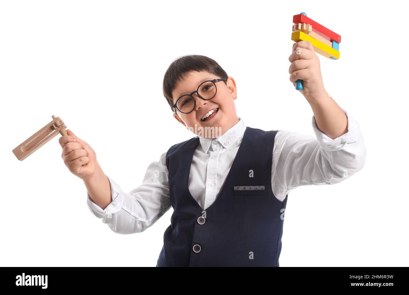 Little Jewish boy with graggers for Purim holiday on white background ...