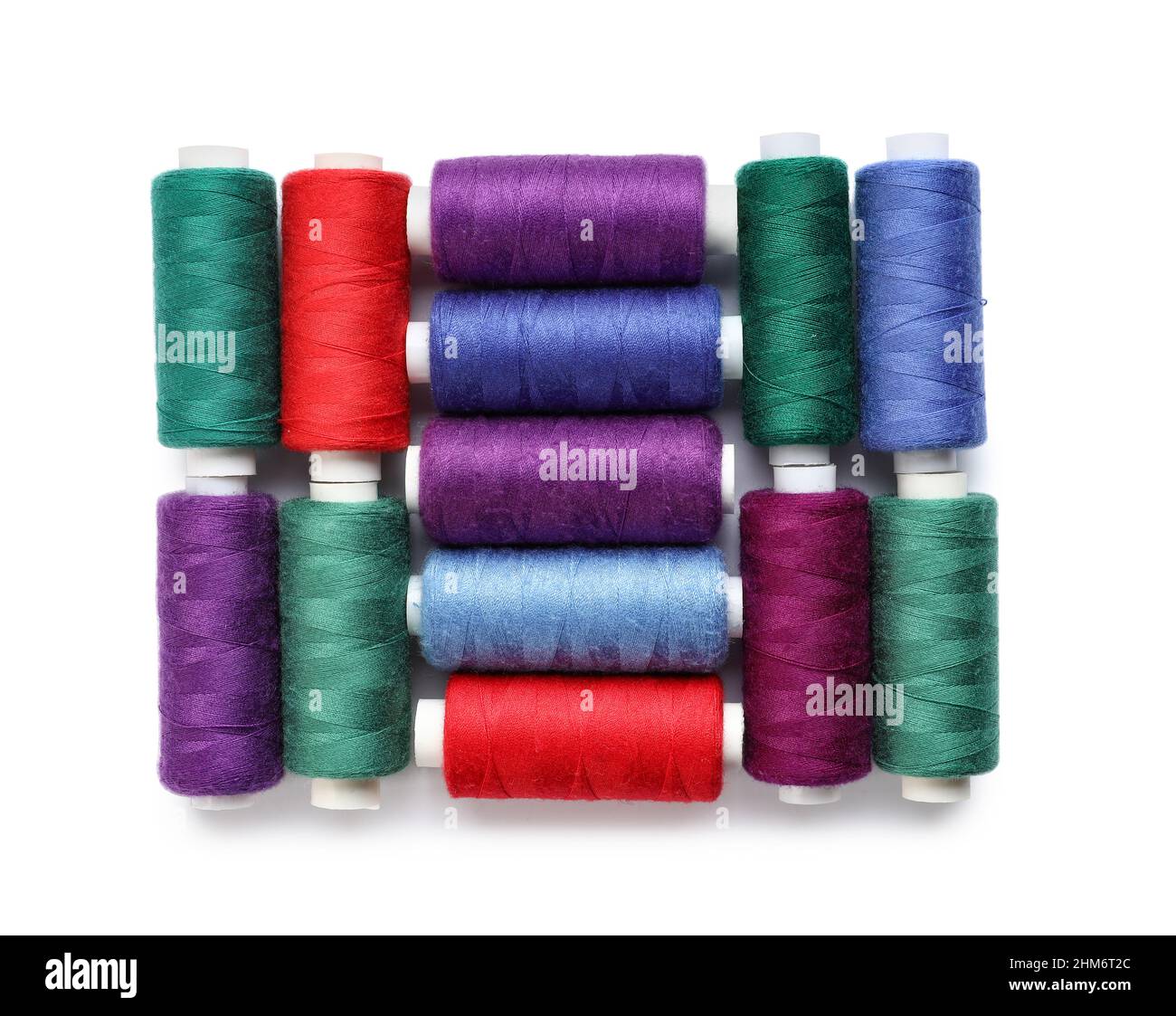 Beautiful sewing threads on white background Stock Photo - Alamy