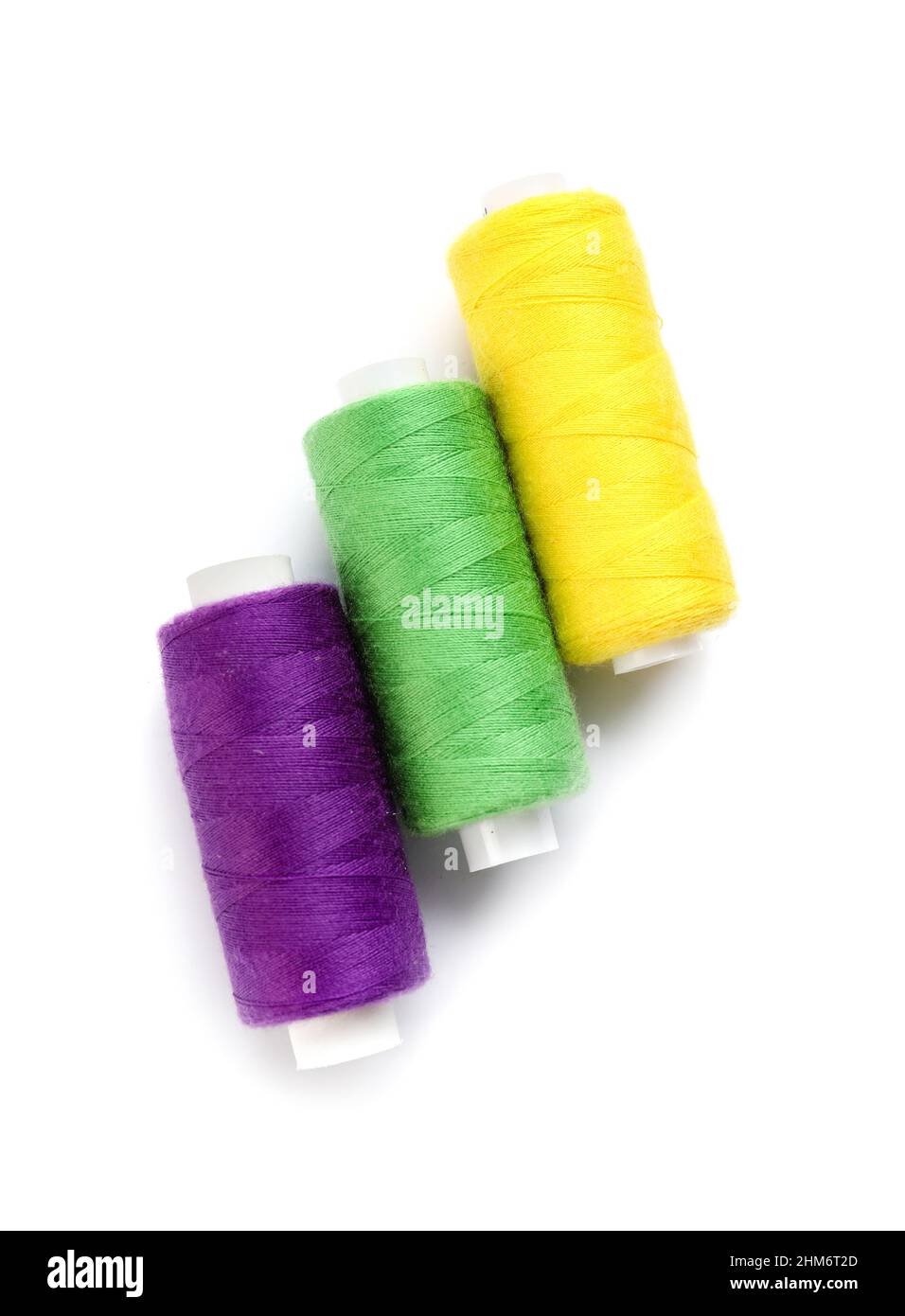 Beautiful sewing threads on white background Stock Photo - Alamy