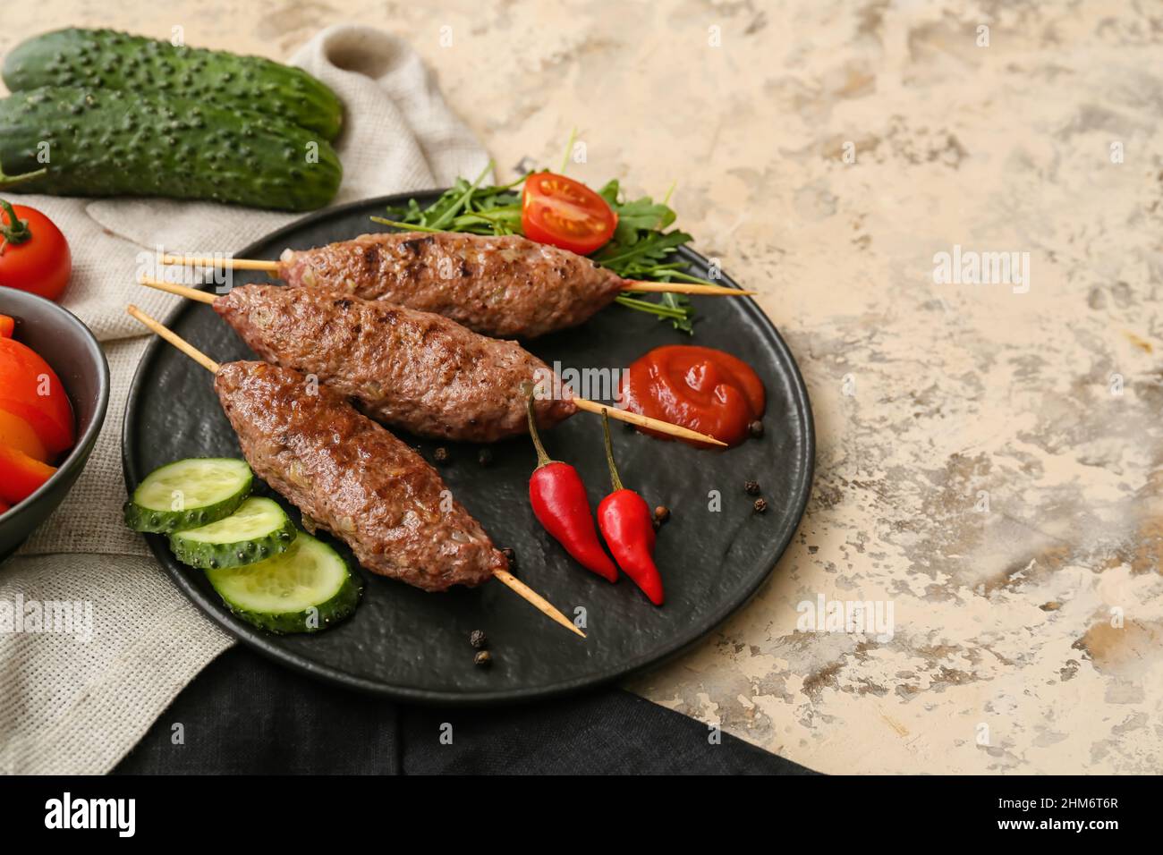 Plate of skewers with tasty lula kebab on beige background Stock Photo ...