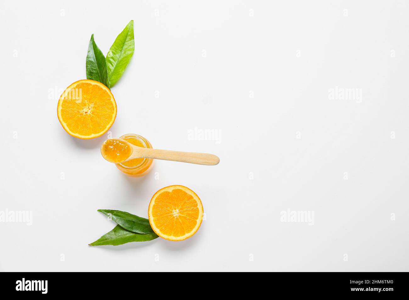 Composition with tasty orange jam on white background Stock Photo - Alamy
