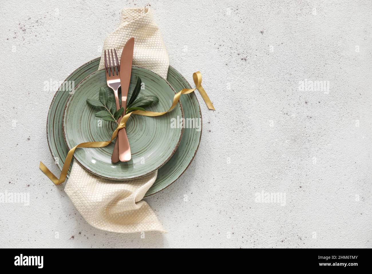 Stylish simple table setting on light background Stock Photo - Alamy
