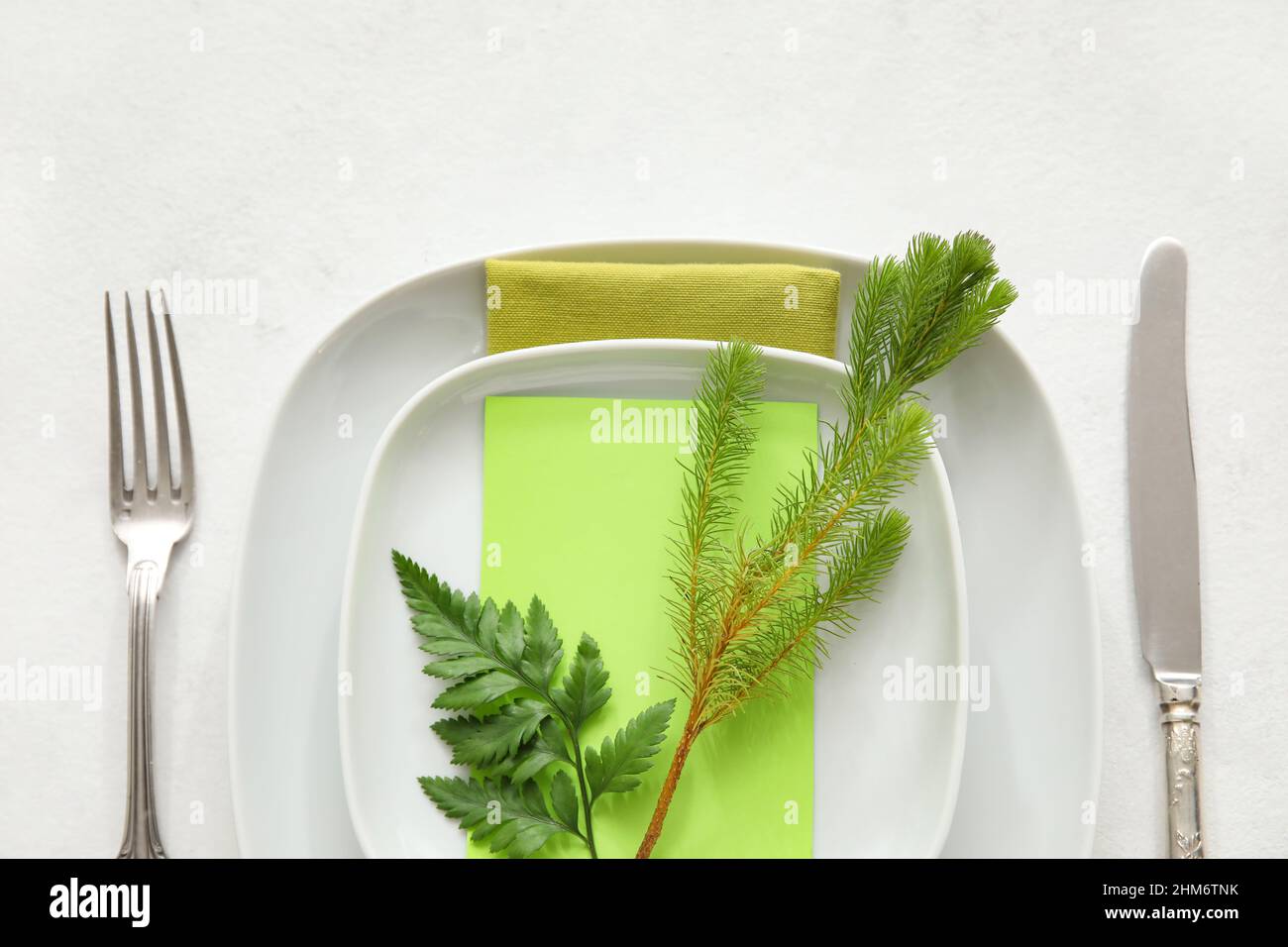Stylish simple table setting on white background Stock Photo - Alamy