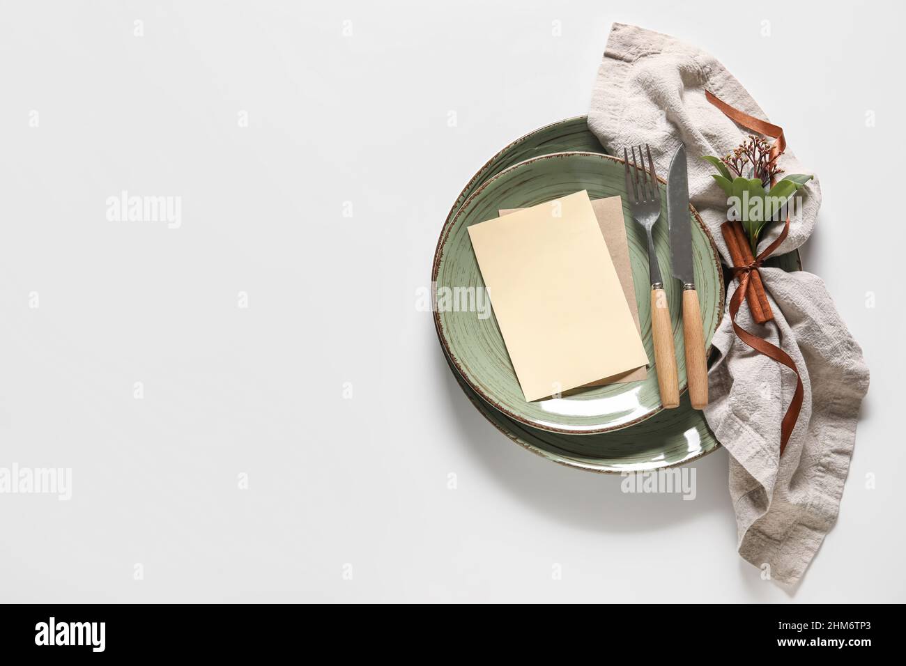 Stylish simple table setting on white background Stock Photo - Alamy