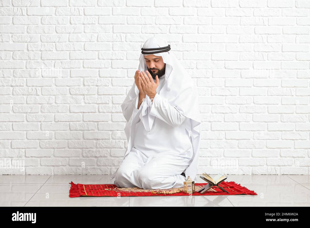 Muslim man praying at home Stock Photo - Alamy
