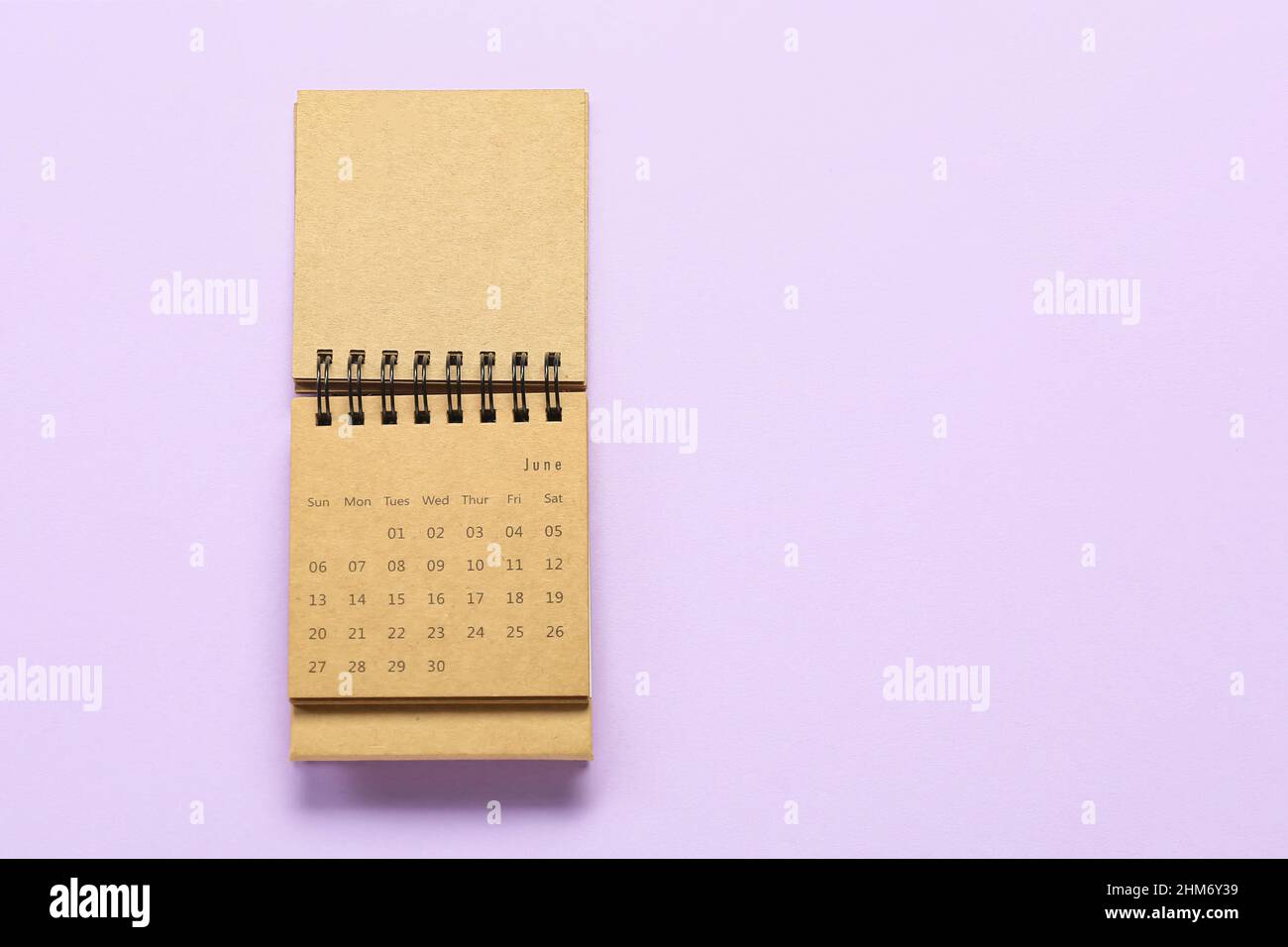 Craft calendar on lilac background Stock Photo - Alamy