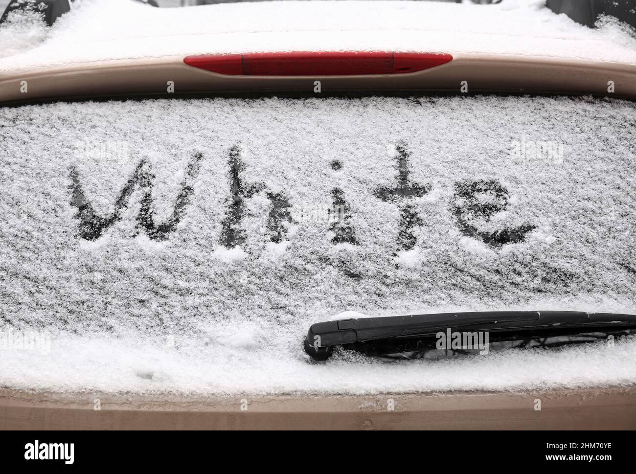 Word WHITE written on car window covered with snow Stock Photo - Alamy