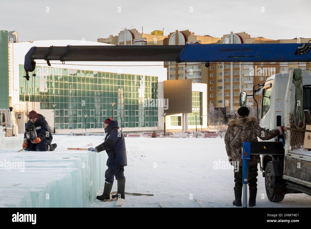 The slinger hooks the rope slings onto the hook of the truck crane ...