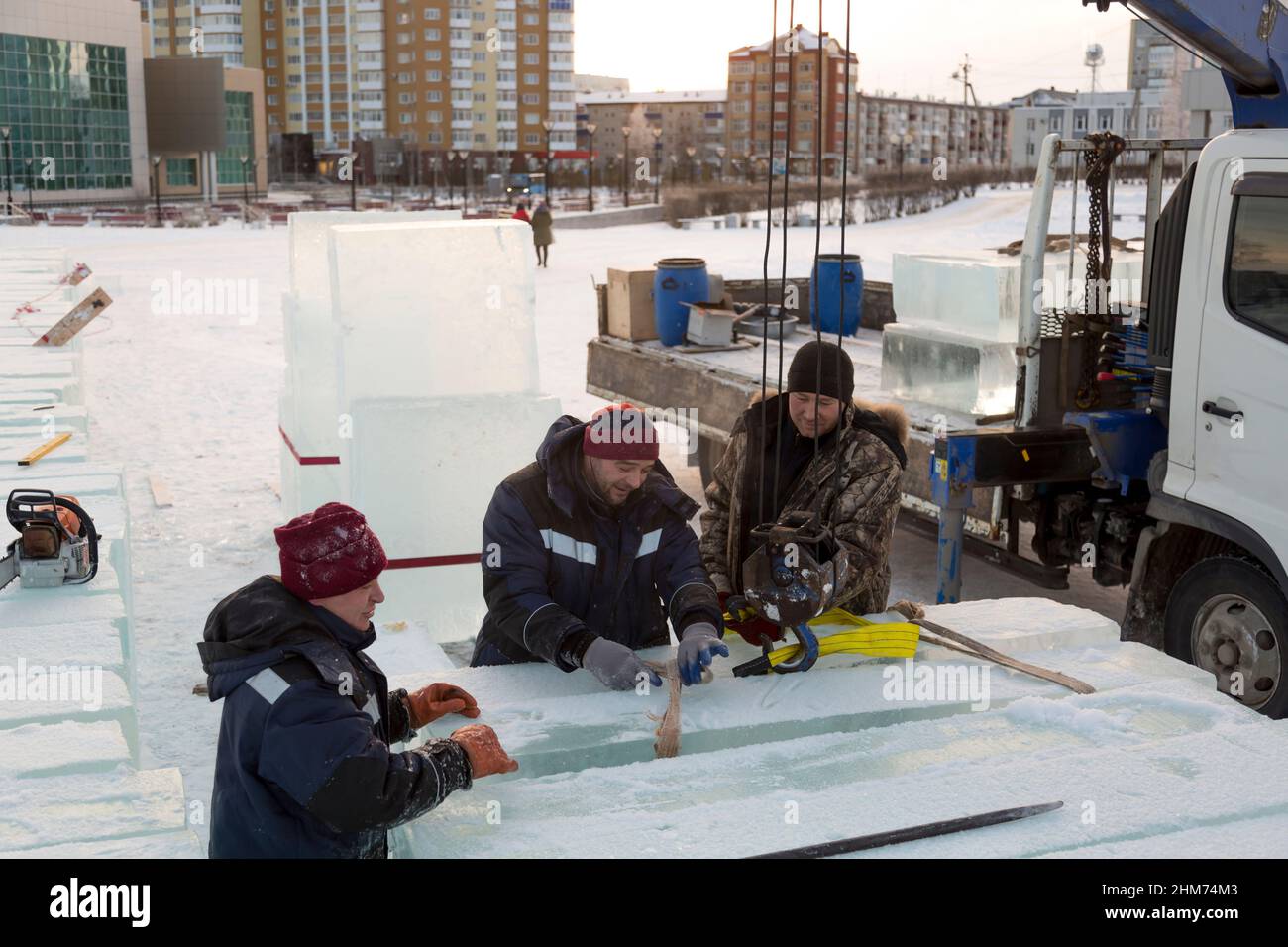 The slinger hooks the rope slings onto the hook of the truck crane ...