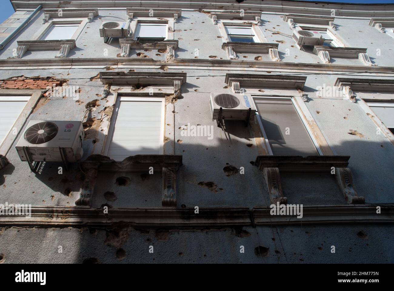 A building with shell holes ies abandoned after being destroyed in the ...