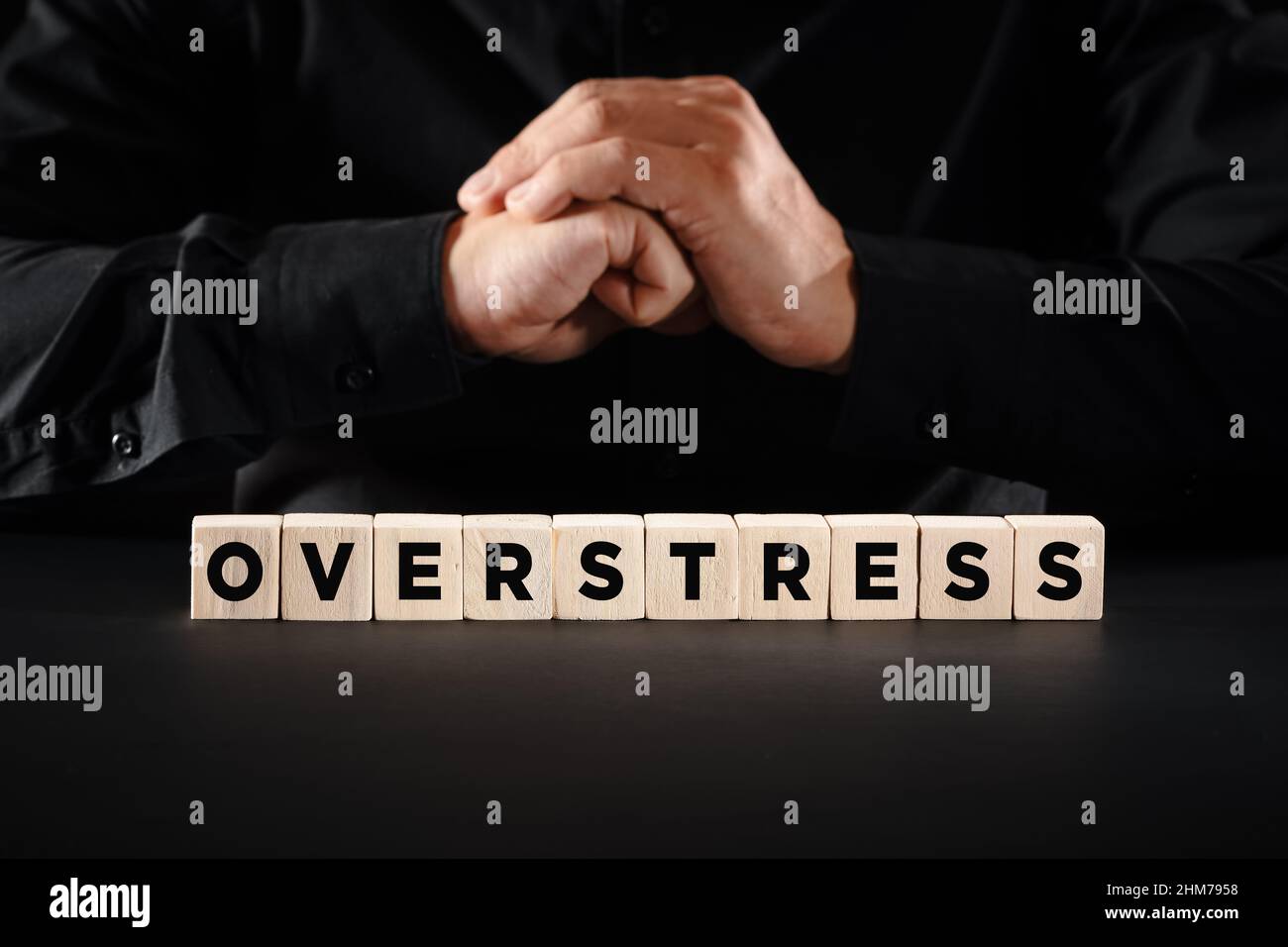 Emotional stress concept. Man with clasped hands with the word ...