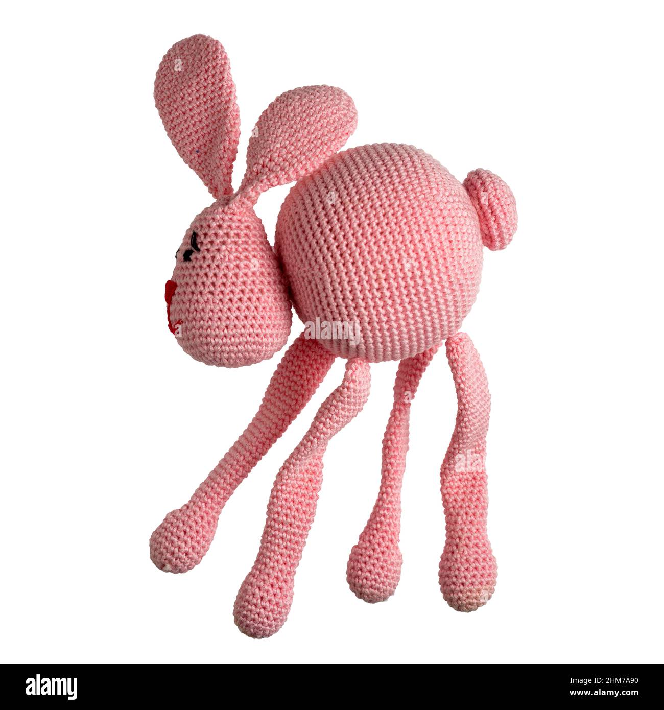 amigurumi crocheted pink rabbit toy isolated on white background Stock ...
