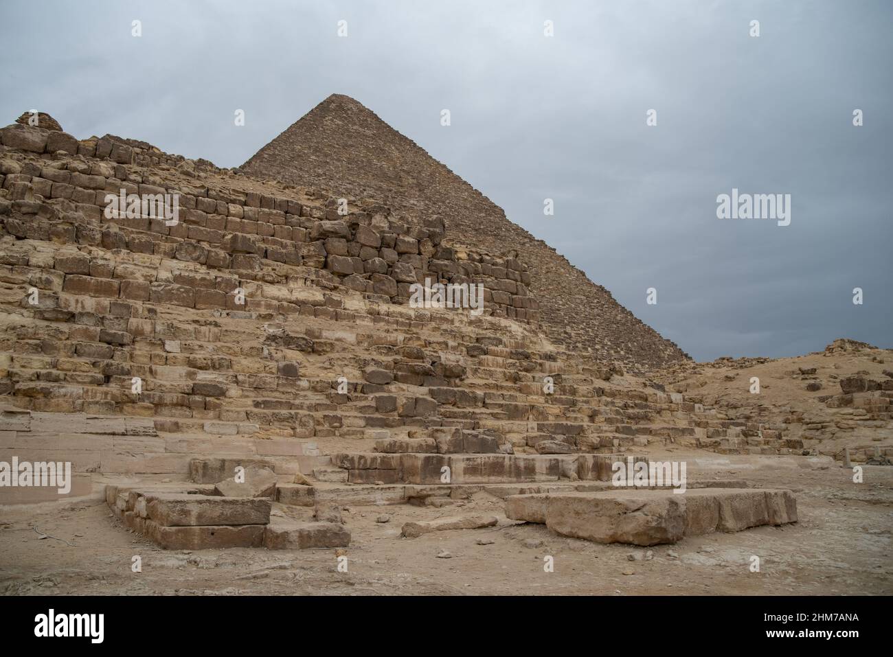 Ruins of the small pyramid of Queen Henutsen with Cheops Pyramid at ...