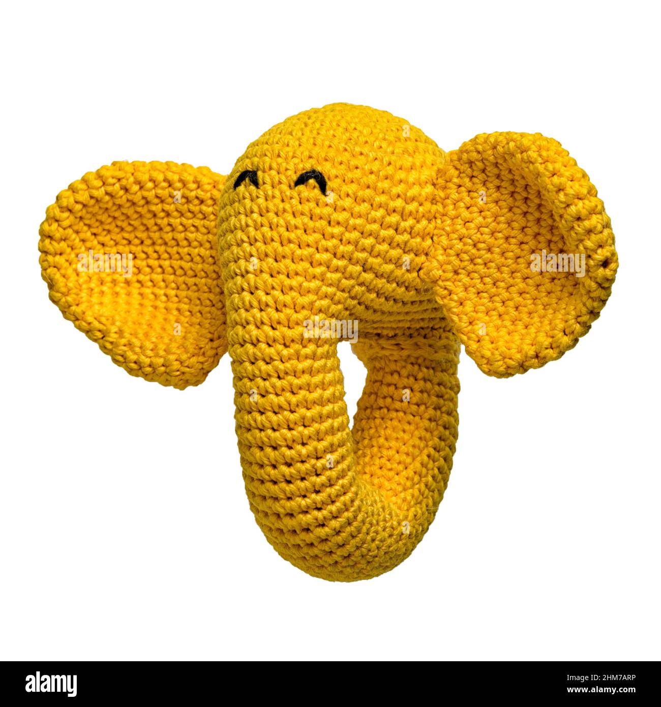 amigurumi crocheted yellow elephant toy isolated on white background ...