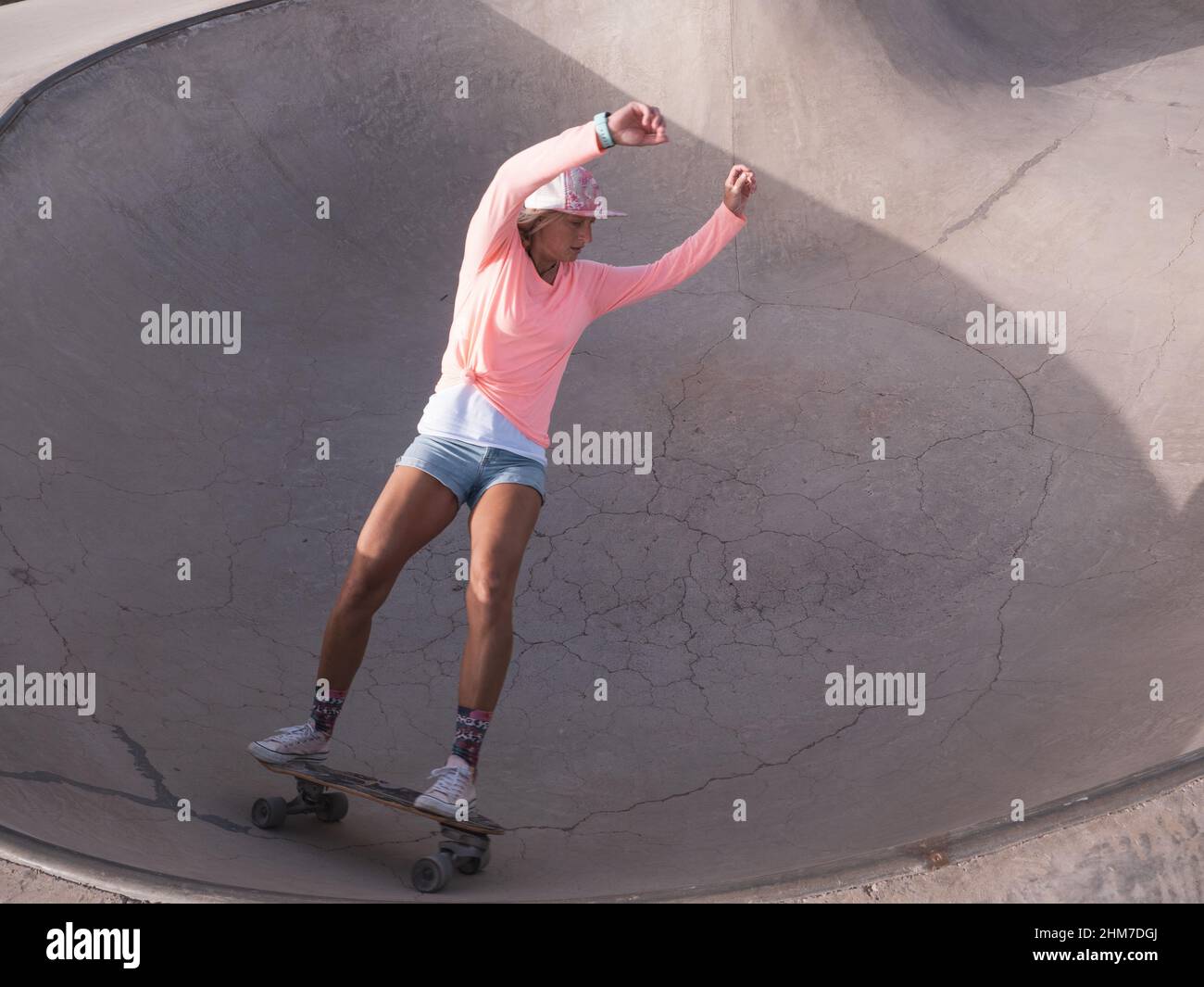 Caucasian woman skating in the skate bowl Stock Photo - Alamy