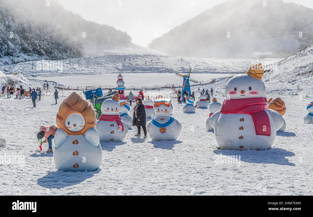 CHONGQING, CHINA - FEBRUARY 7, 2022 - Tourists enjoy snowmen at the ...