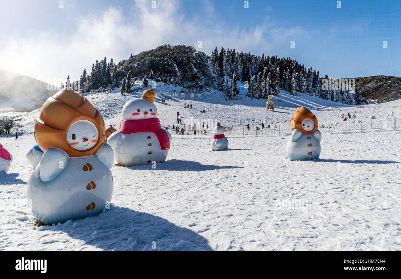 CHONGQING, CHINA - FEBRUARY 7, 2022 - Tourists enjoy snowmen at the ...