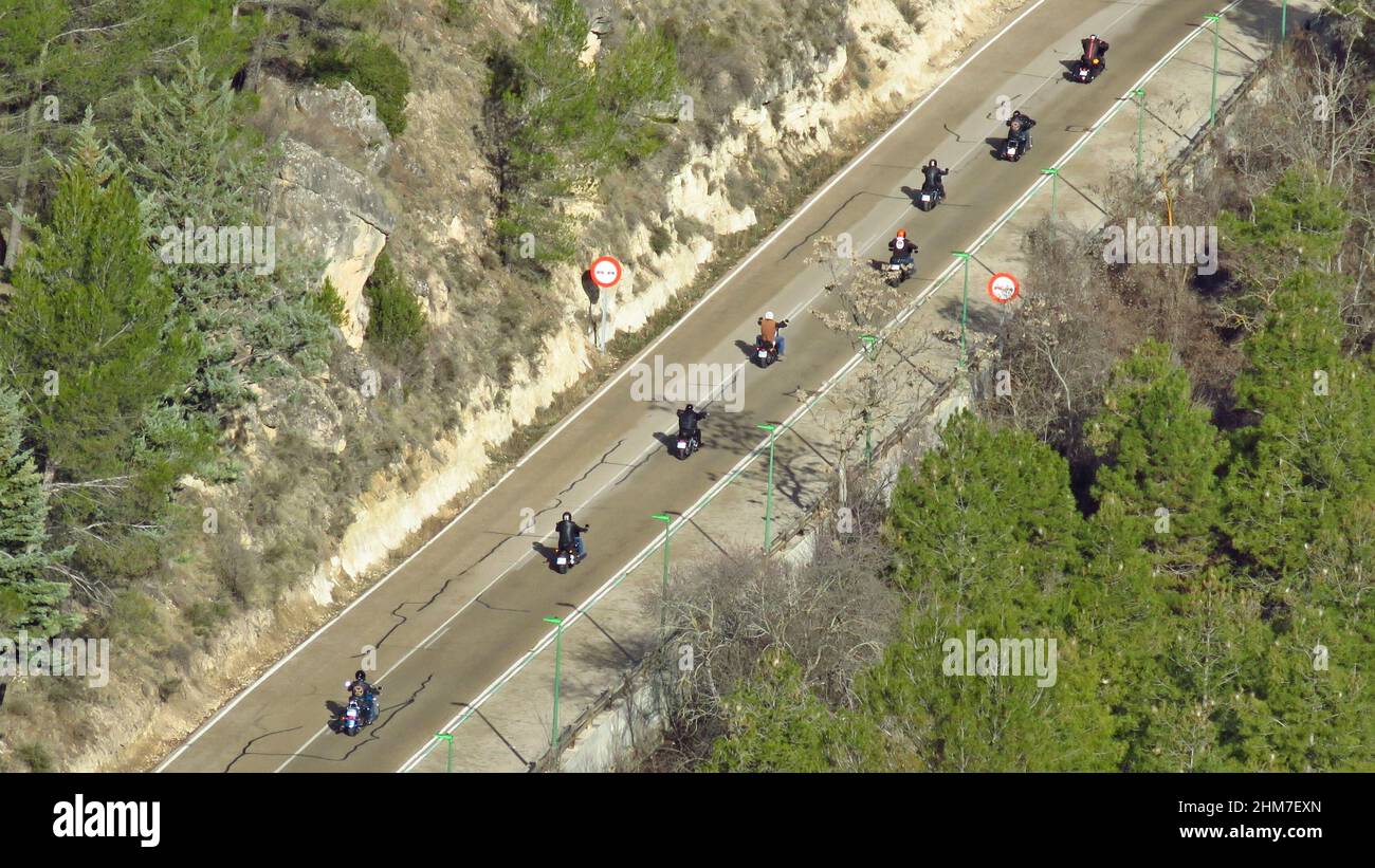 Line of bikers riding along the road Stock Photo - Alamy