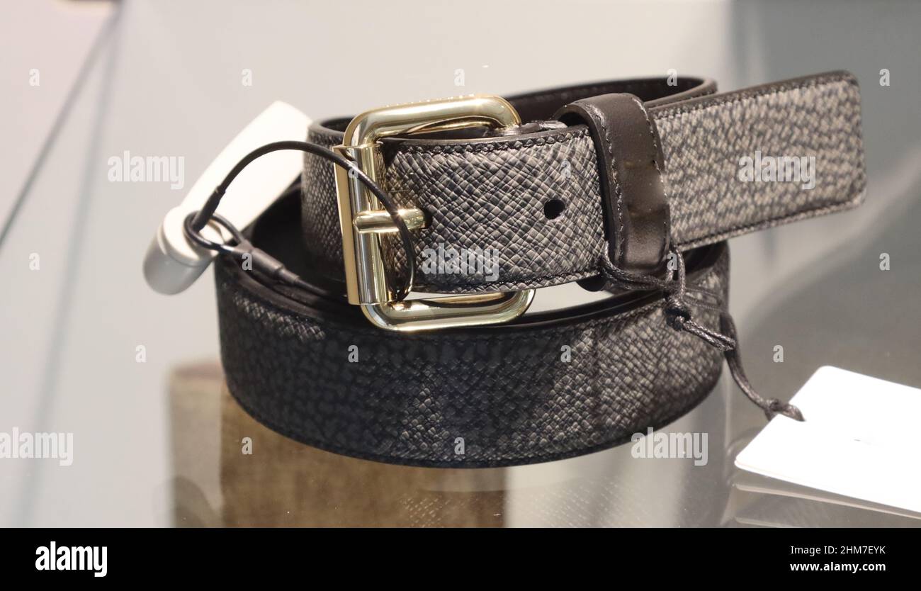 Rolled leather strap on a glass table Stock Photo - Alamy