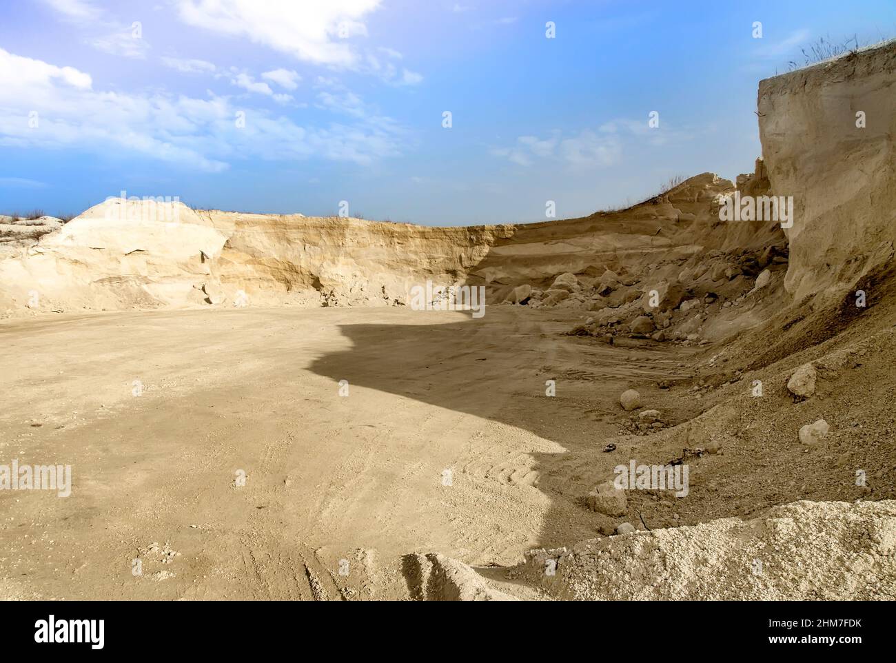 A limestone cliff at a quarry with a beautiful blue sky Stock Photo - Alamy
