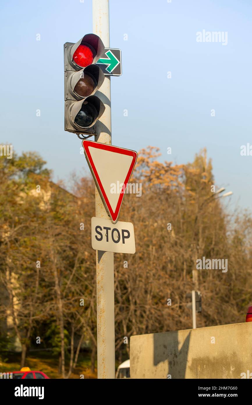 Red traffic light, a Stop sign intersection in a city Stock Photo - Alamy