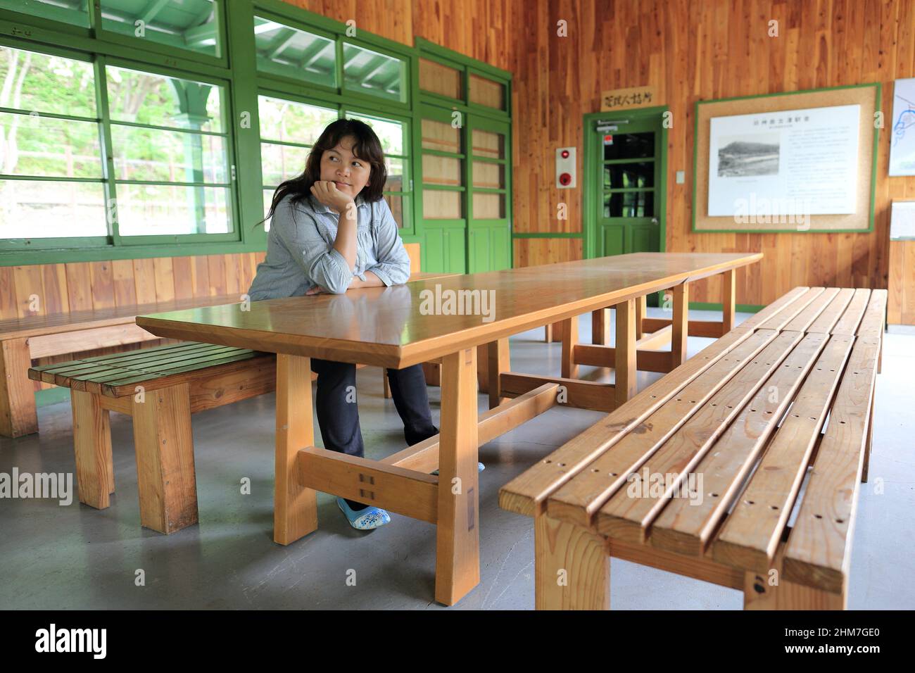 Woman Sitting on a Bench Stock Photo - Alamy
