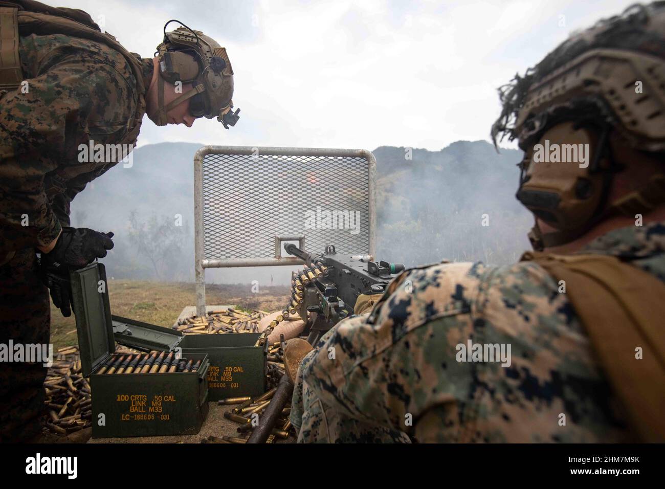A U.S. Marine with 1st Battalion, 3d Marines, 3d Marine Division, fires ...