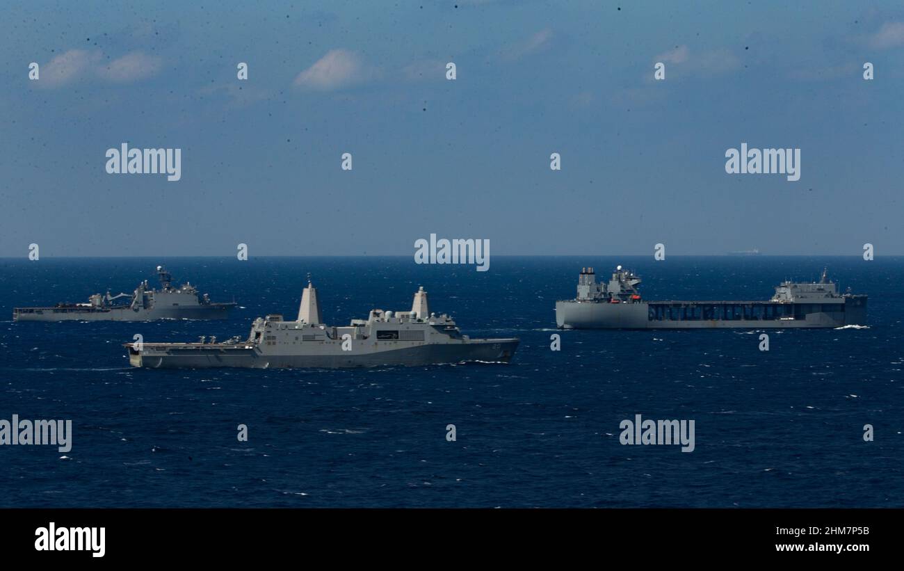 Expeditionary staging base USS Miguel Keith(ESB-5) (right) is flanked ...