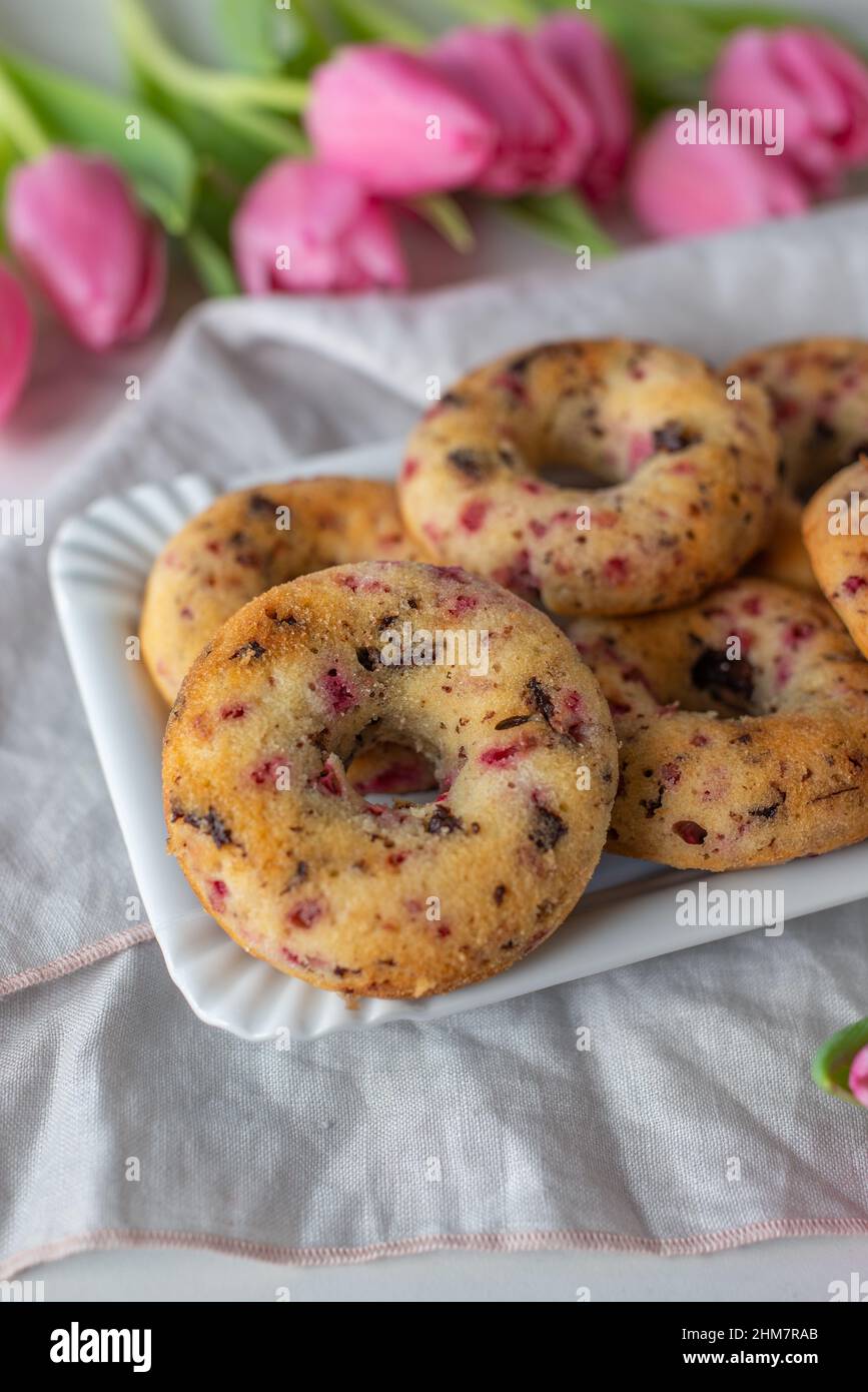 sweet berry chocolate donuts Stock Photo - Alamy