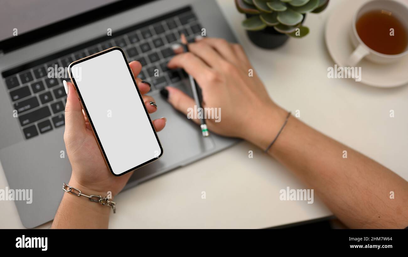Female officer working on laptop computer, typing on keyboard and ...