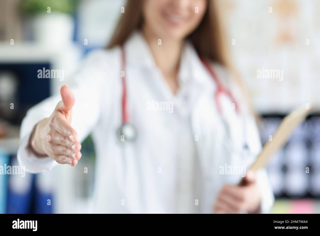 Doctor woman give hand to greet someone, medical worker in uniform ...