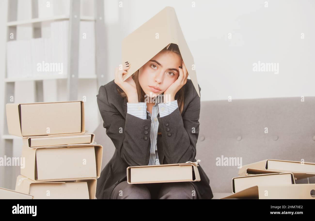 Sad busy secretary with folder on head, stressed overworked business ...
