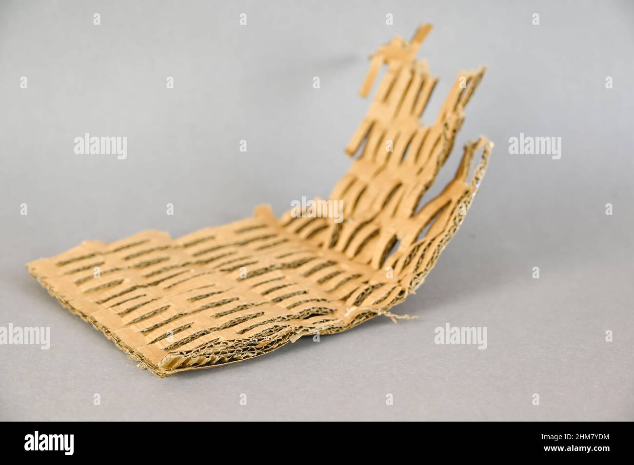 Protective package filler opposite the gray background. Eco-friendly ...