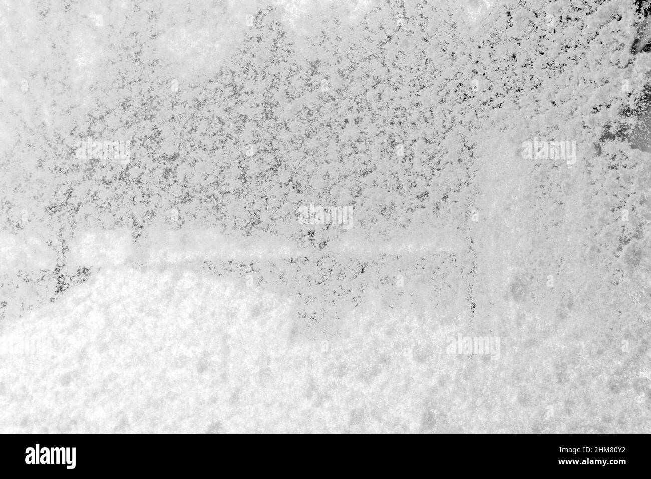 A snowy window during a heavy blizzard. View from the indoor, covered ...