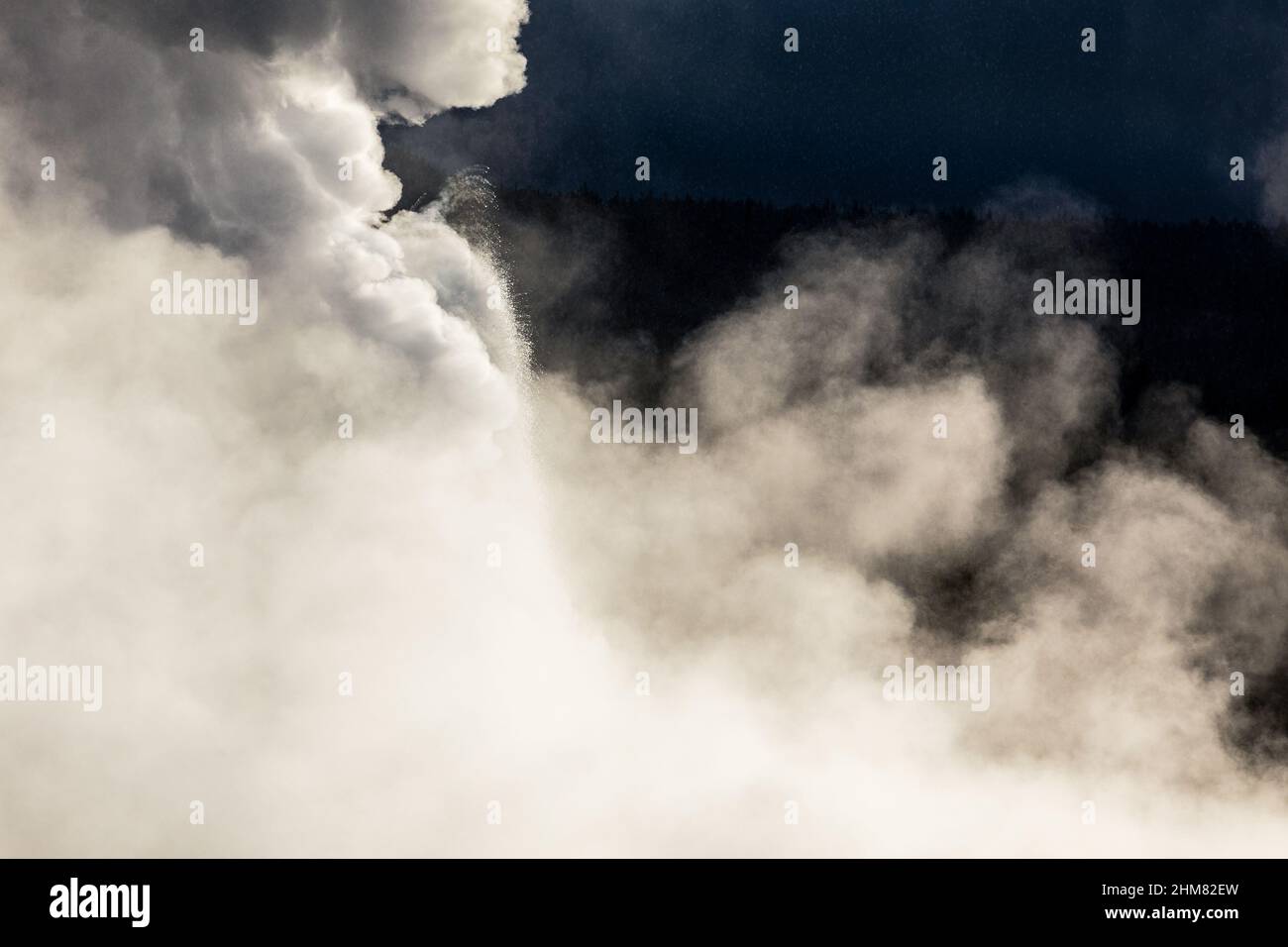 Close focus on exploding smoke of old Faithful, famous geyser of ...