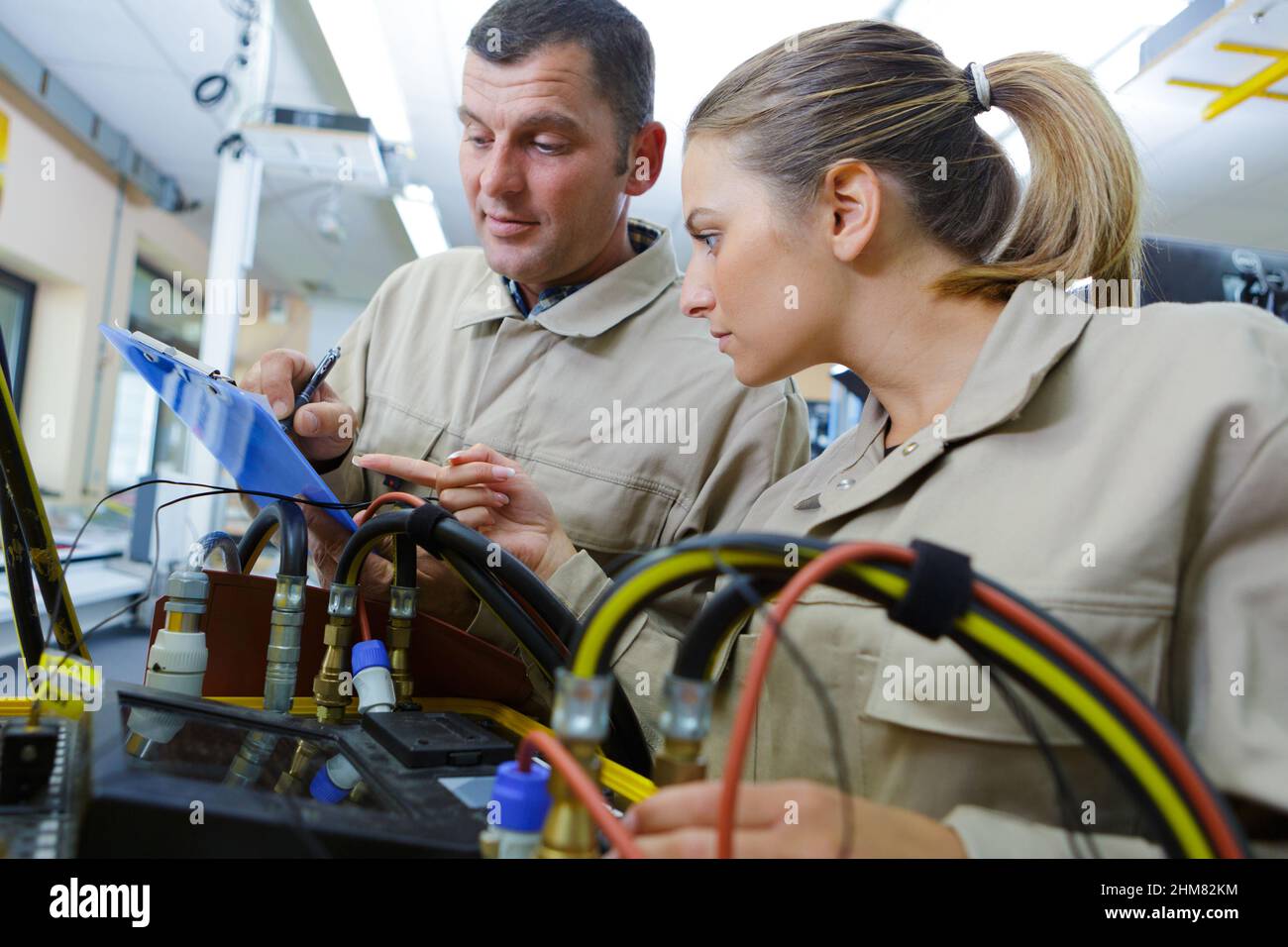 two engineers working with cables Stock Photo - Alamy