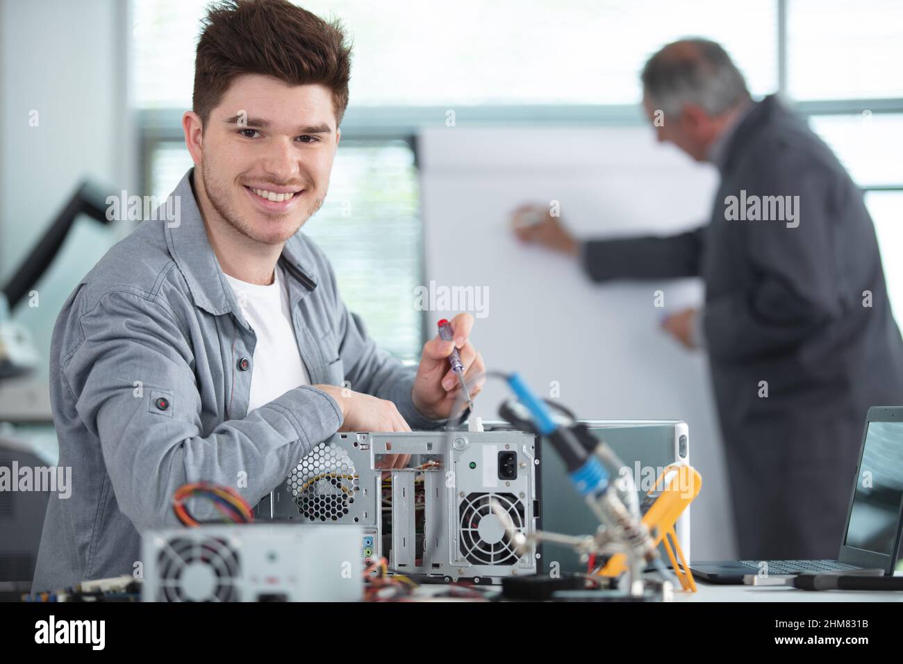 trainee technician learning how to wire up a computer Stock Photo - Alamy