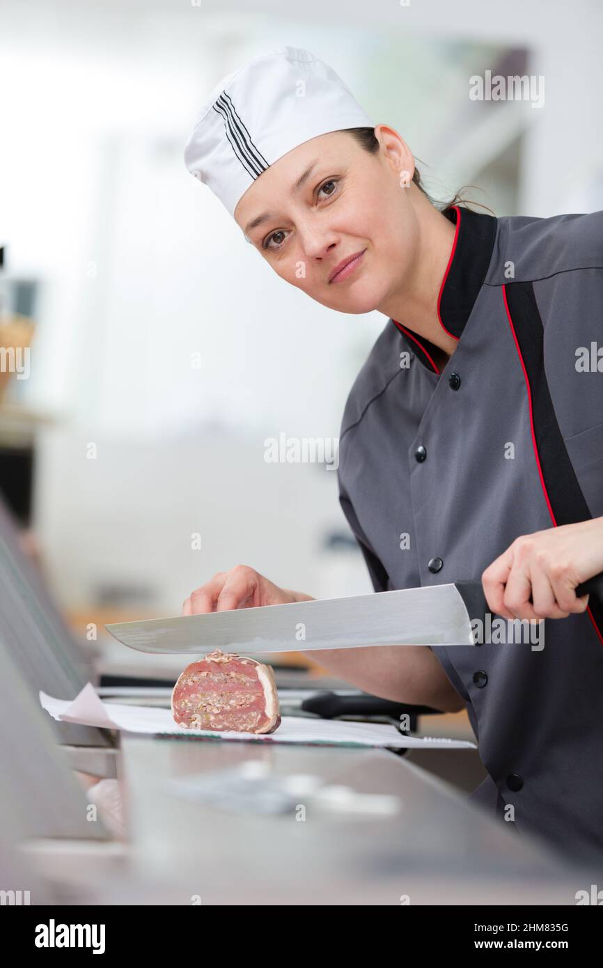 Woman cutting meat hi-res stock photography and images - Alamy