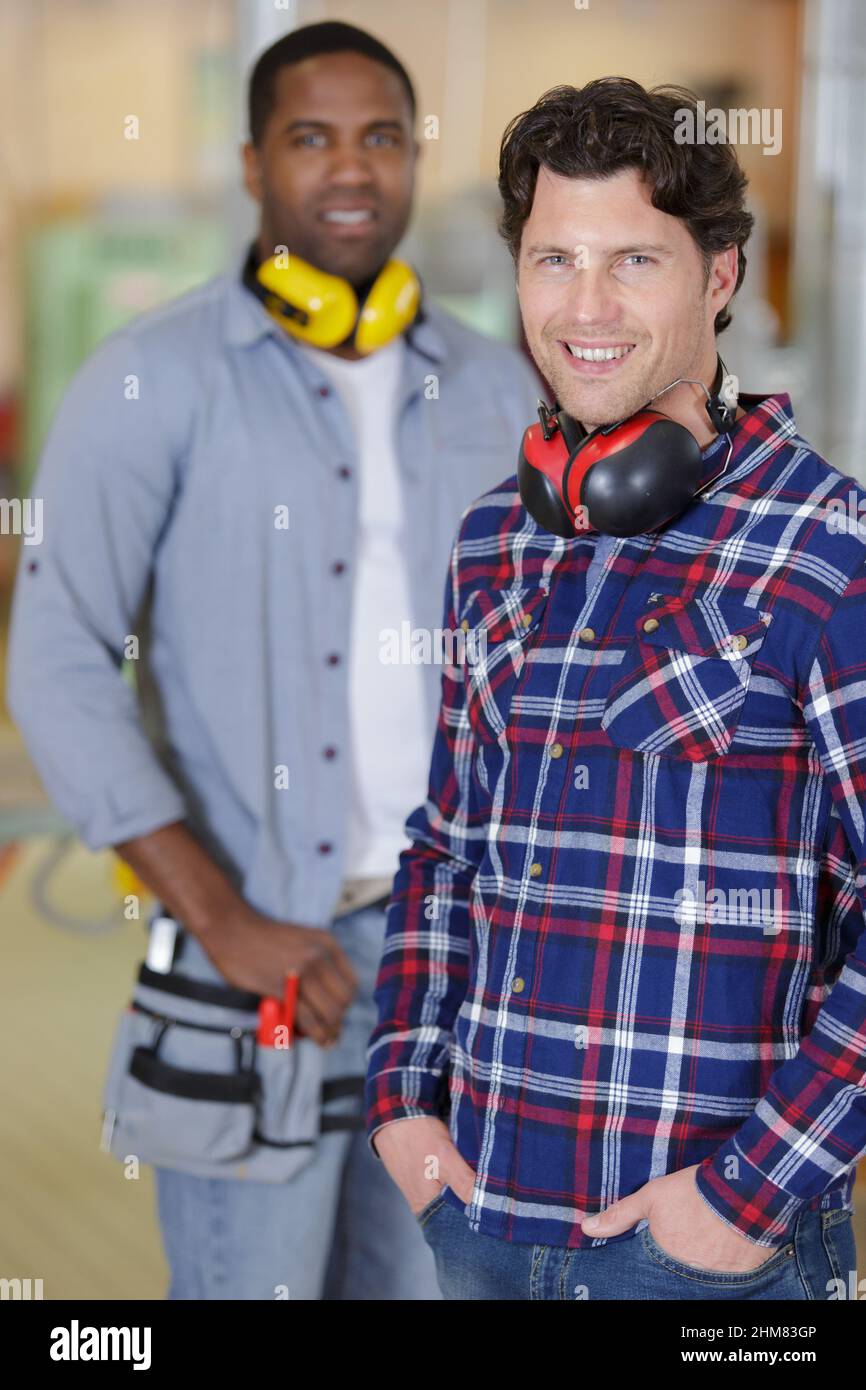 two engineers looking at the camera Stock Photo - Alamy