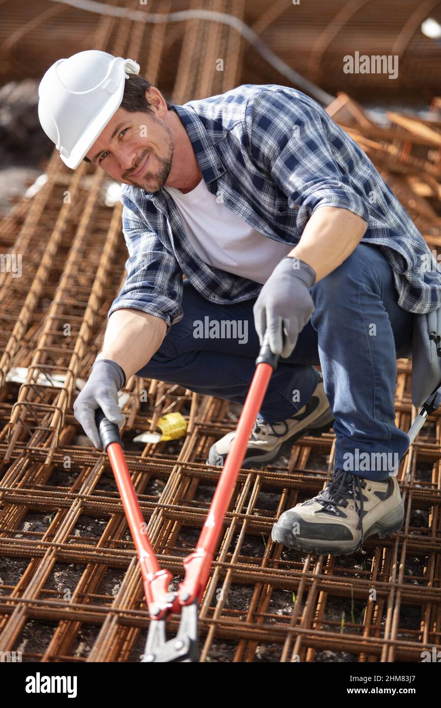 male construction worker working on the construction of the foundation ...
