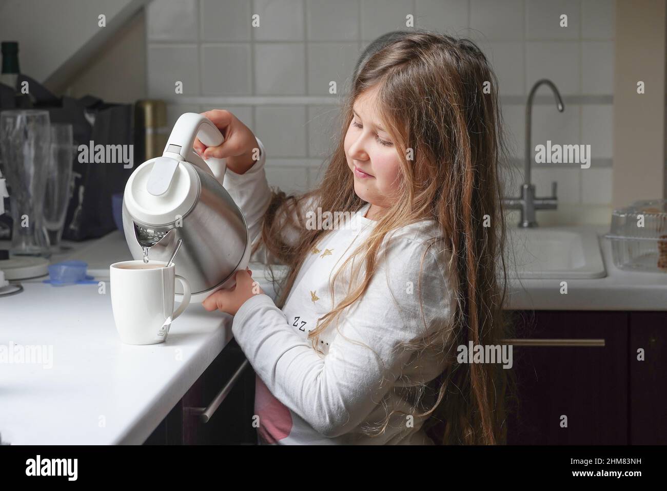 A little girl helps to cook breakfast at home Stock Photo - Alamy