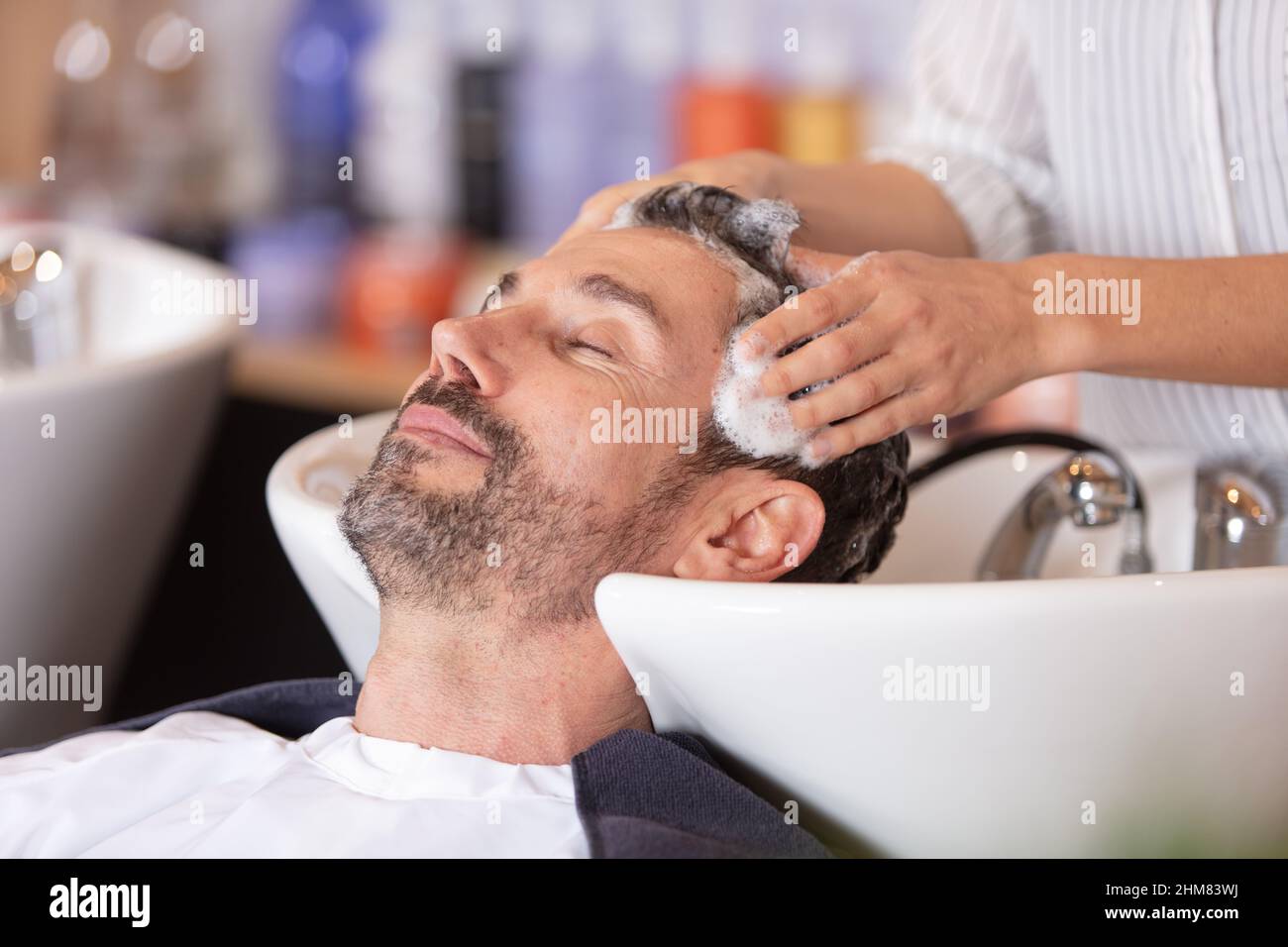 Man having hair washed shampoo hi-res stock photography and images - Alamy