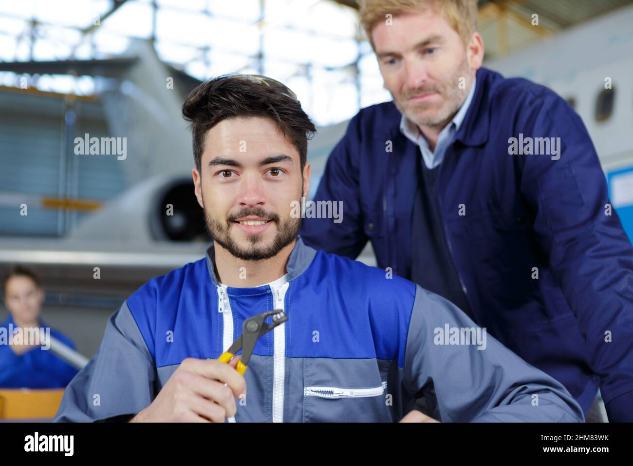 portrait of two flight engineers Stock Photo - Alamy