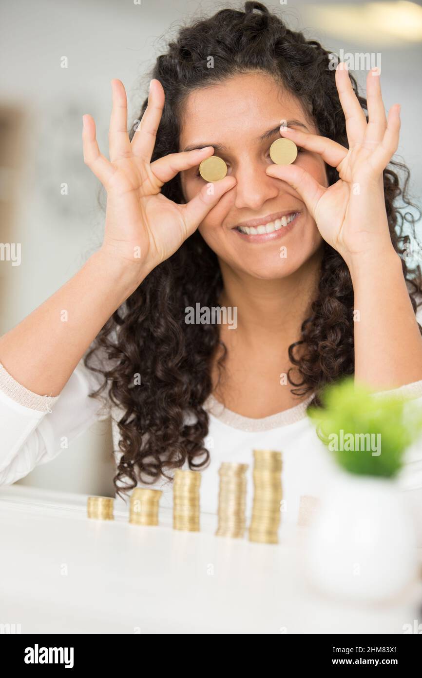 pretty young woman saving money Stock Photo - Alamy