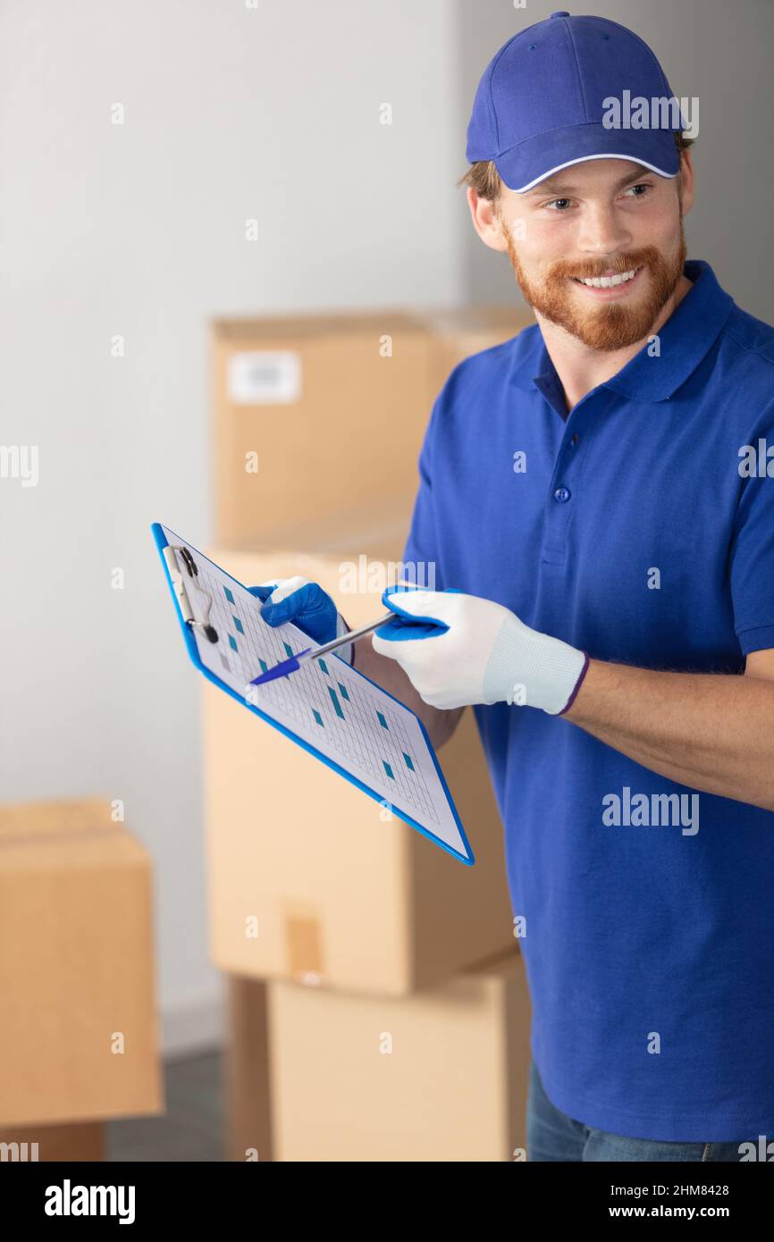 Delivery worker signing form van hi-res stock photography and images ...