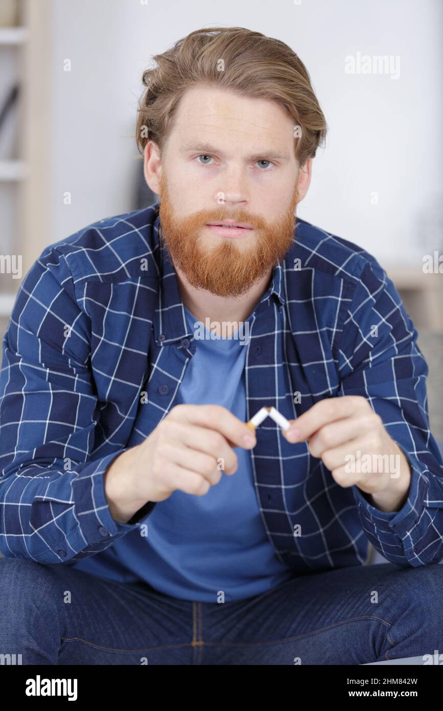 Man breaking cigarettes not woman hi-res stock photography and images ...