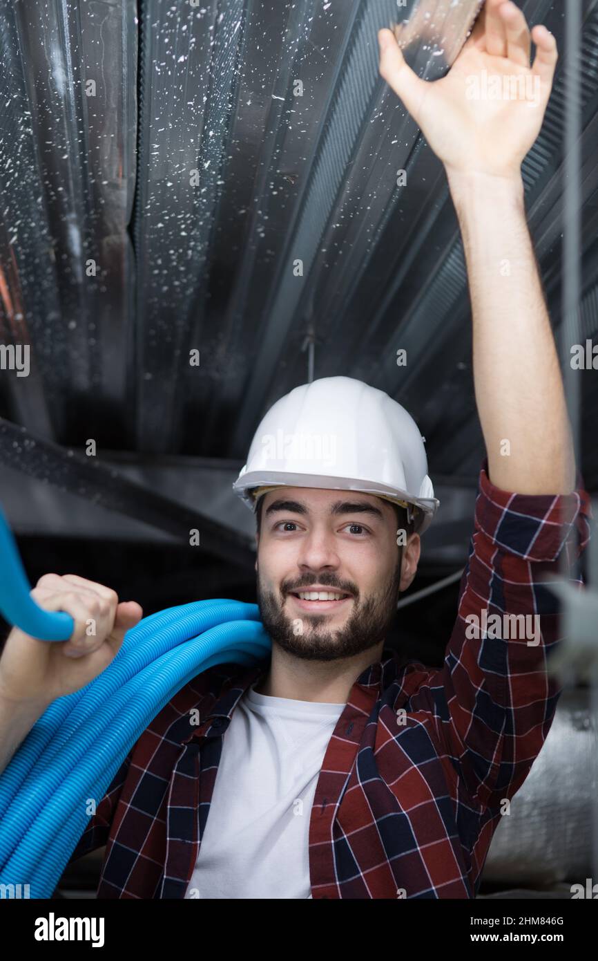 Construction pipes red helmet hi-res stock photography and images - Alamy