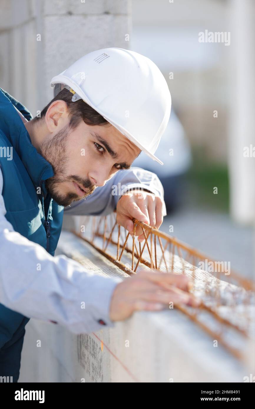 portrait of engineer man looking at wall structure Stock Photo - Alamy
