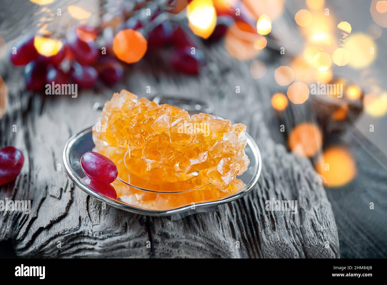 Asian grape sugar Nabat or Navat on grey background with copy space ...